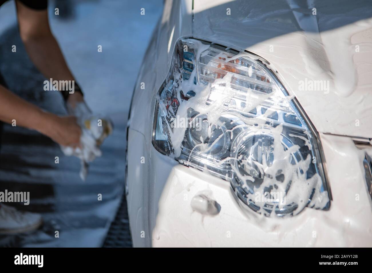 strong man washing car at self carwash outdoors Stock Photo - Alamy