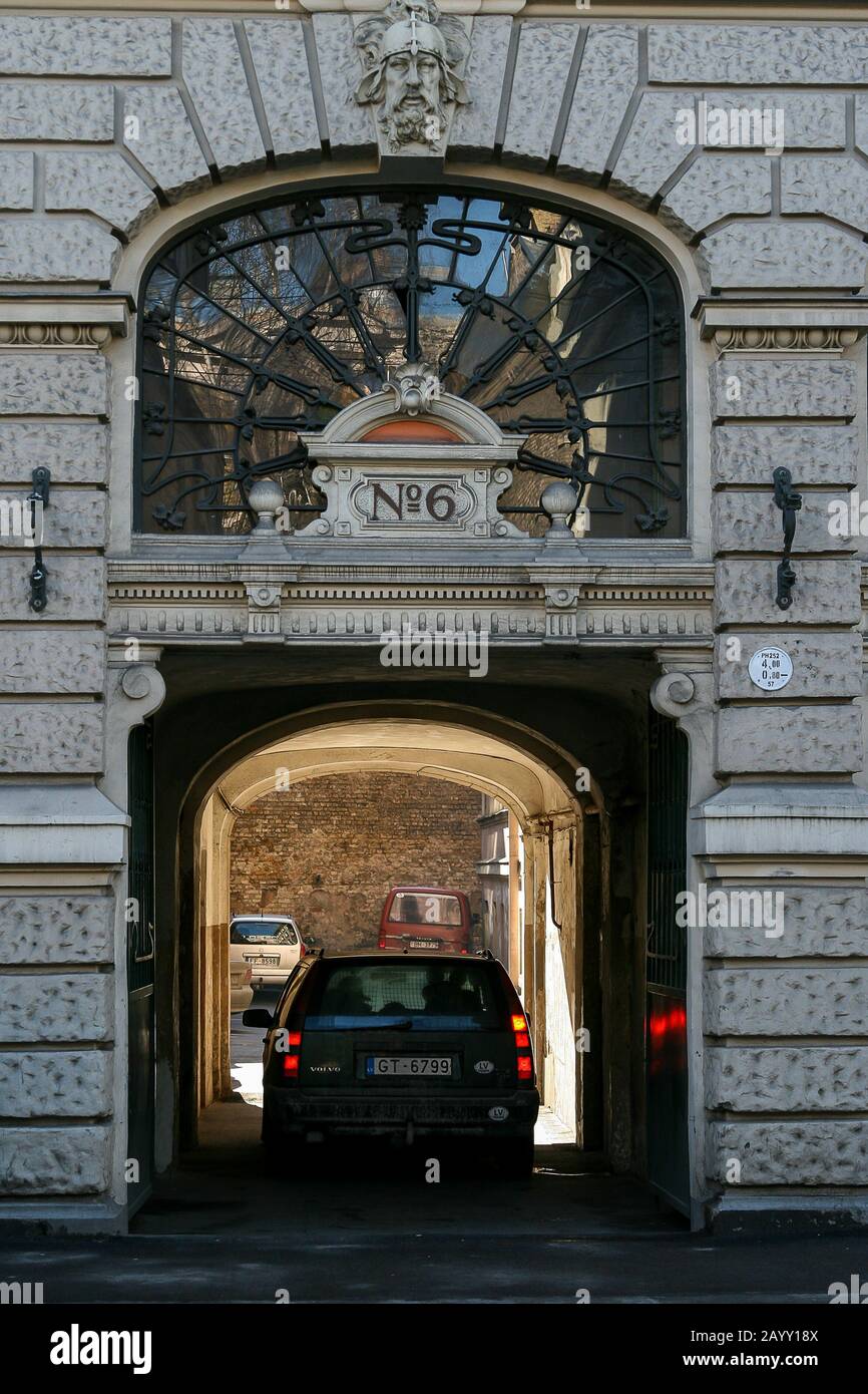 Car entering an entryway to an art nouveau building in Riga Stock Photo ...