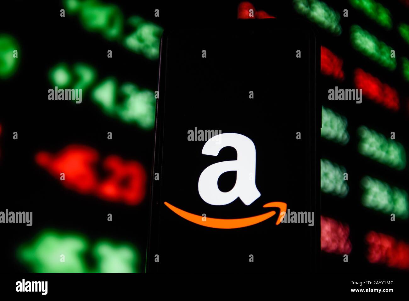 In this photo illustration an Amazon logo seen displayed on a ...