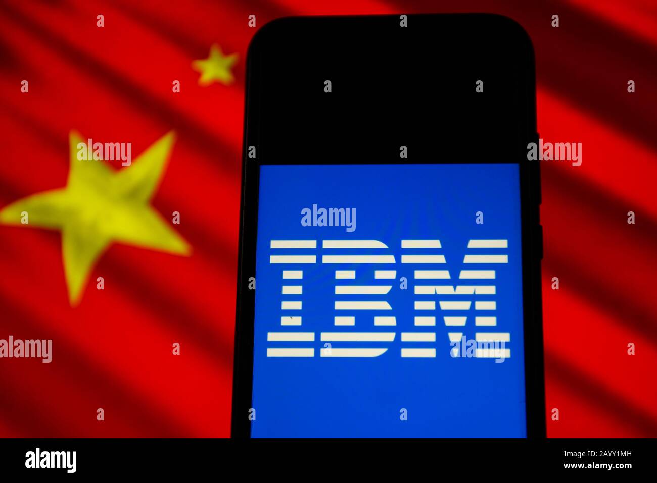 In this photo illustration an IBM logo seen displayed on a smartphone ...