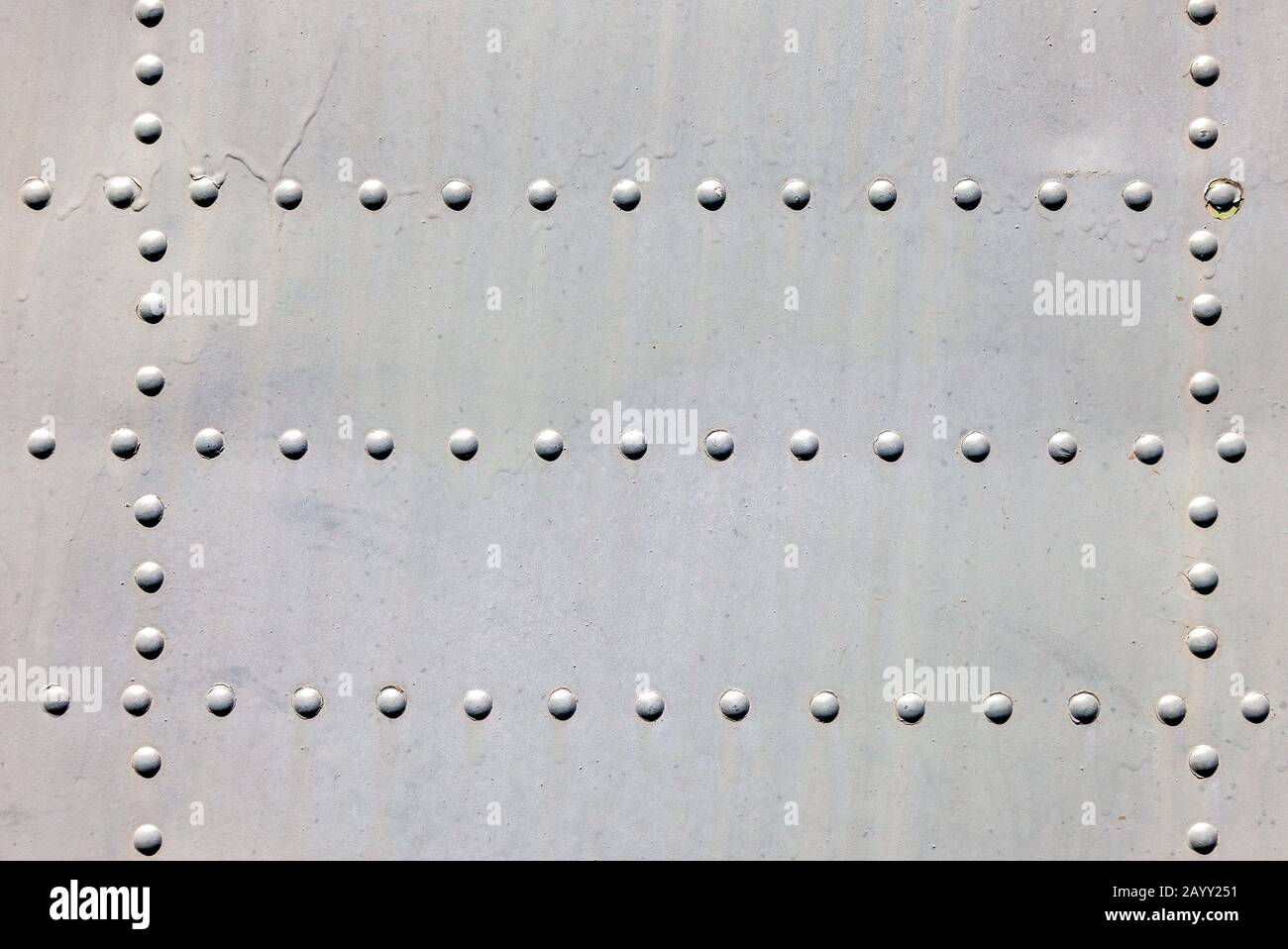 Grey metal surface with rivets as background Stock Photo - Alamy