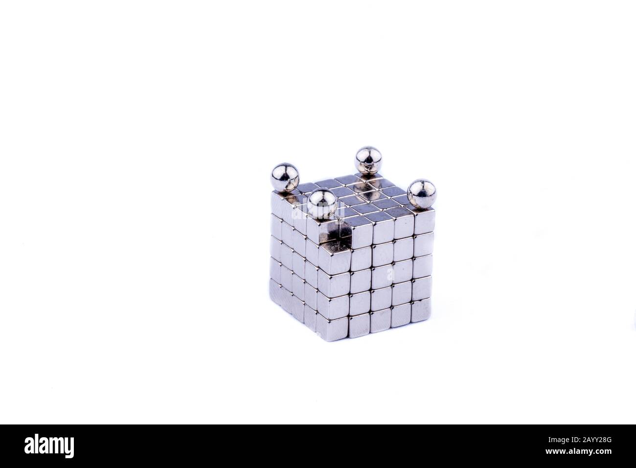 Funny thinking out of the box in toy magnet cubes and balls isolated on ...