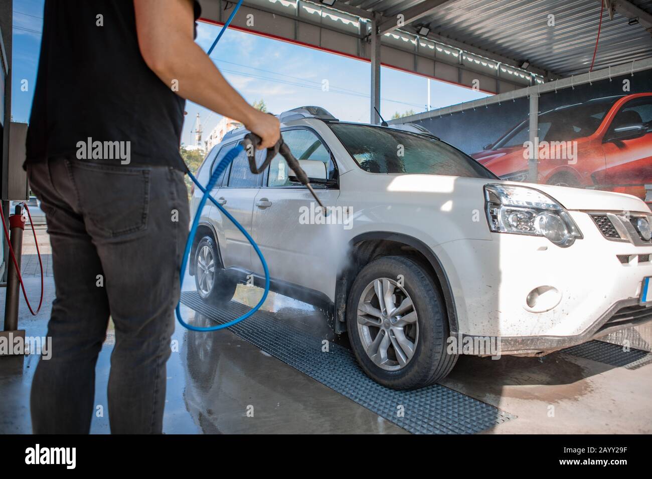 strong man washing car at self carwash outdoors Stock Photo - Alamy
