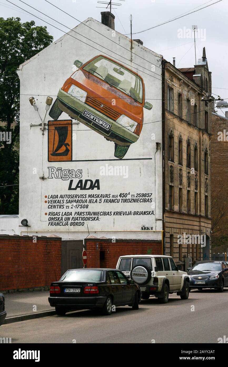 Very old painted Lada soviet car advert on a building in Riga Stock ...