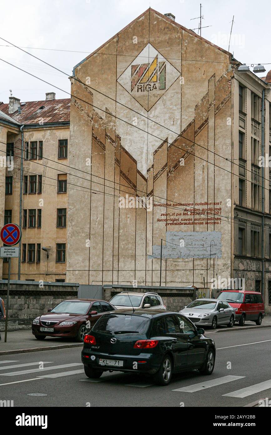 Very old painted soviet advert on a building in Riga Stock Photo - Alamy