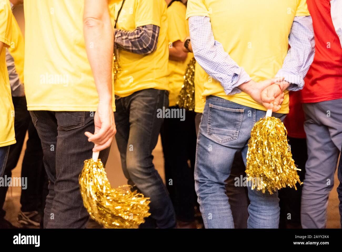 Group of young people divided into two teams dressed in colorful party ...