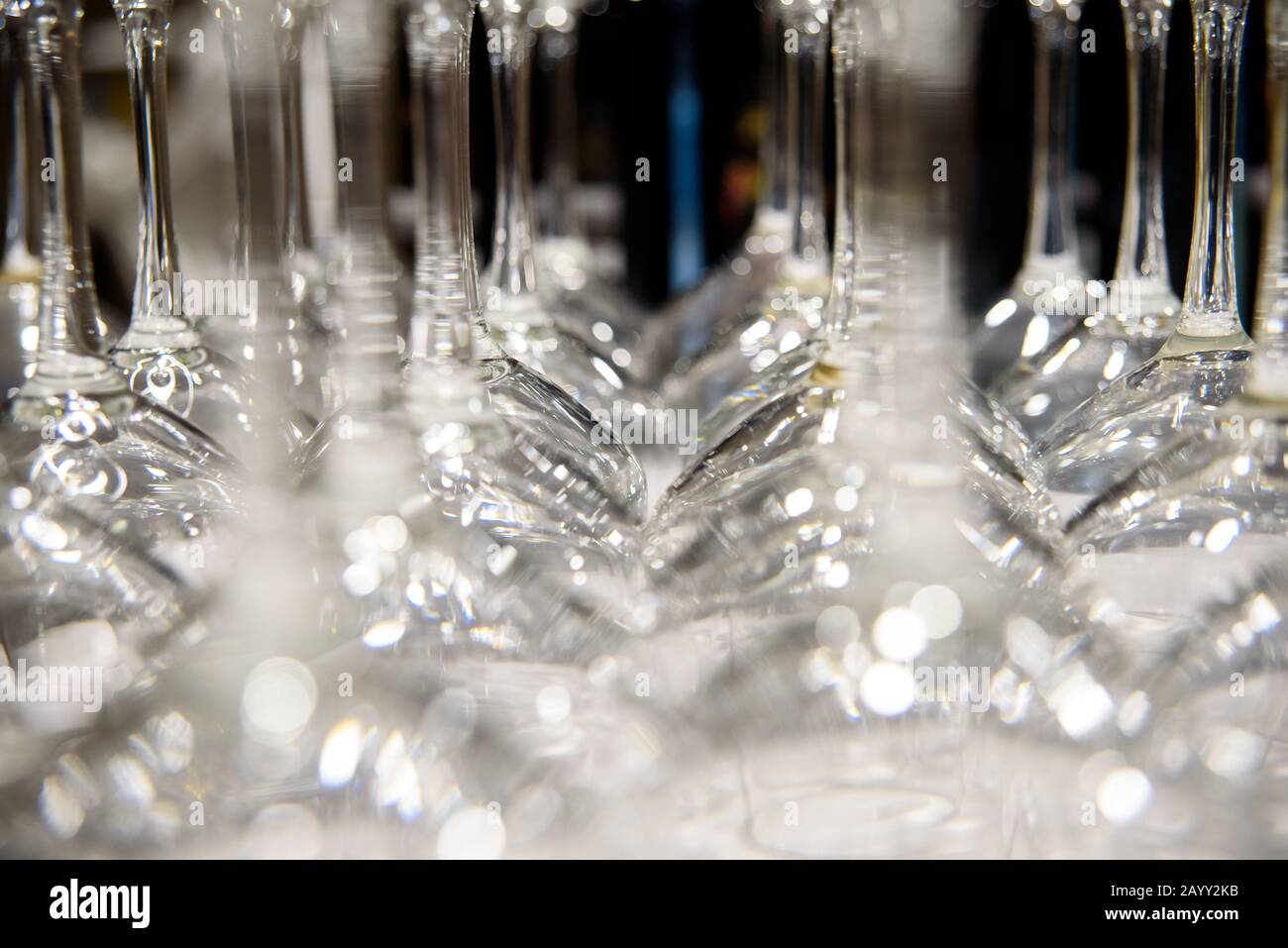 Detail of many clear and clean glass glasses arranged on the table of a ...