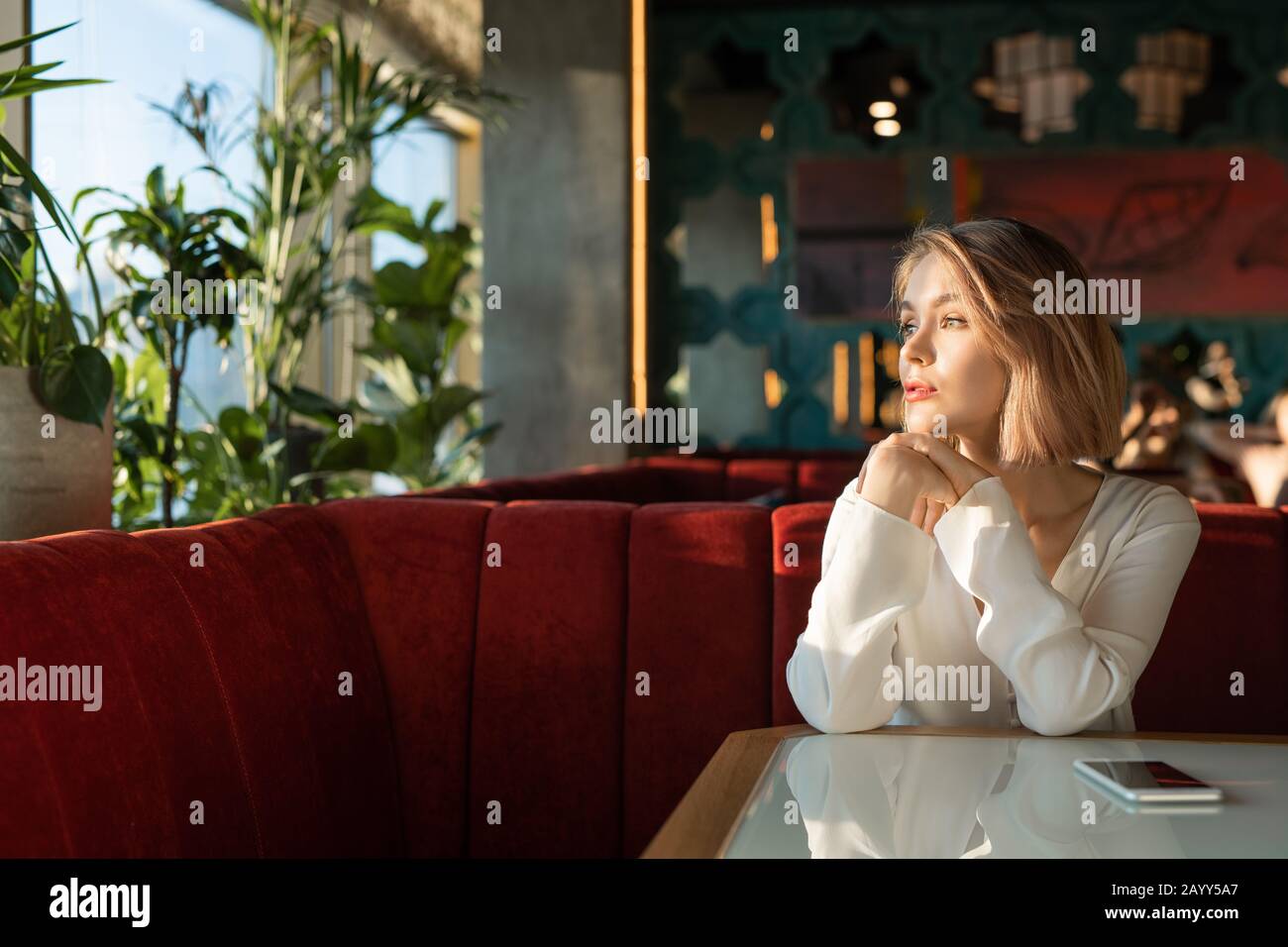 Horizontal females waiting hi-res stock photography and images - Alamy