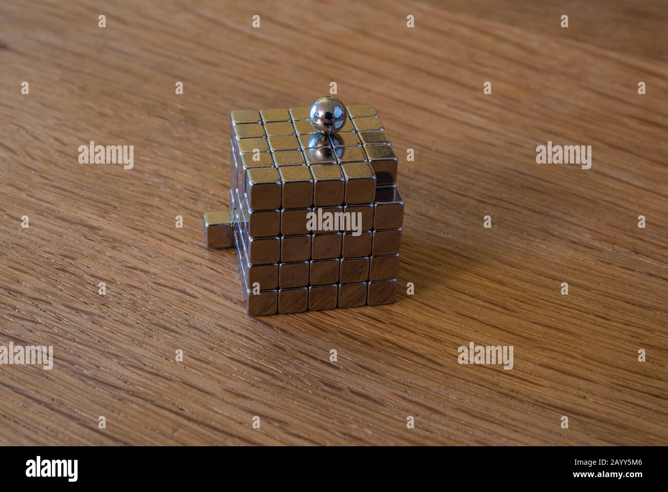 Funny thinking out of the box in toy magnet cubes and balls isolated on ...