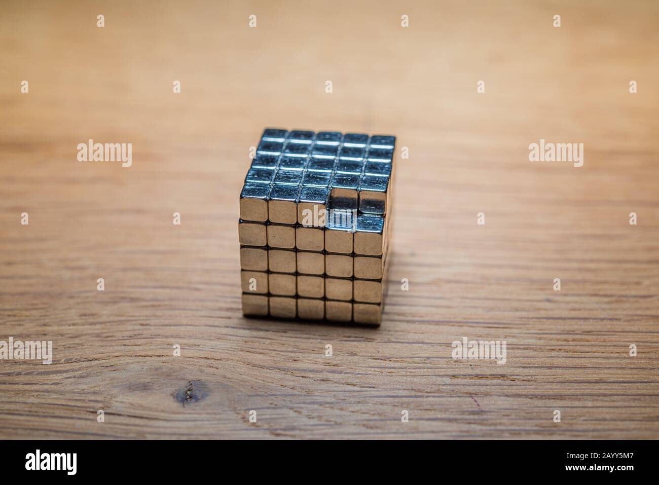 Funny thinking out of the box in toy magnet cubes and balls isolated on ...