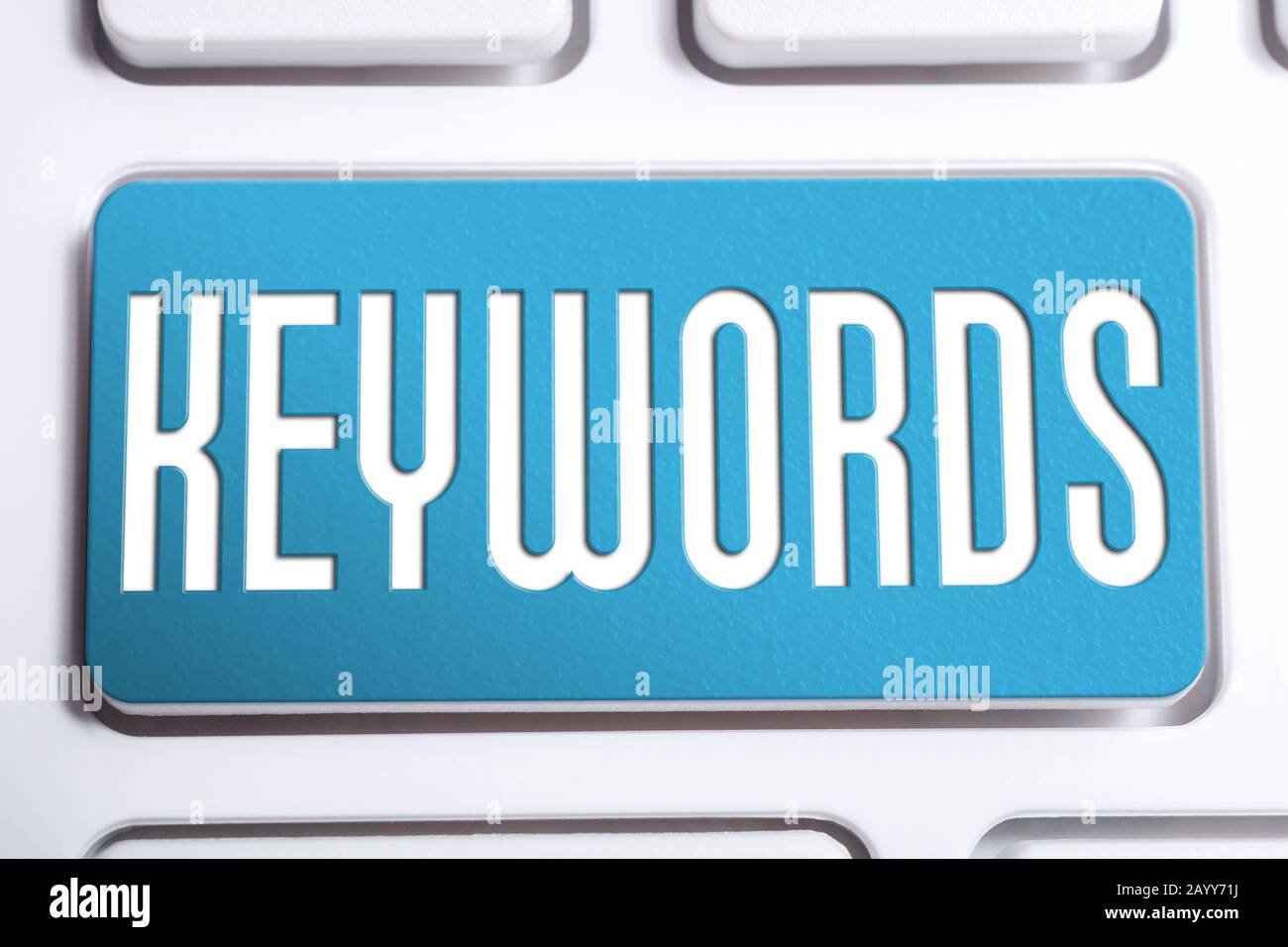 Blue Keywords Button On A White Keyboard Stock Photo - Alamy