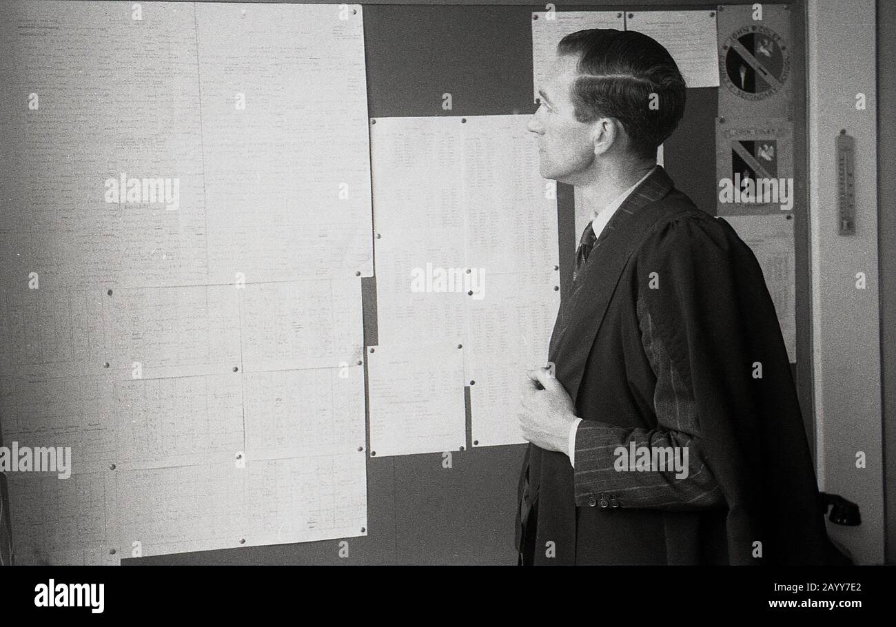 1950s, historical, senior male teacher, possibly headmaster, wearing a ...