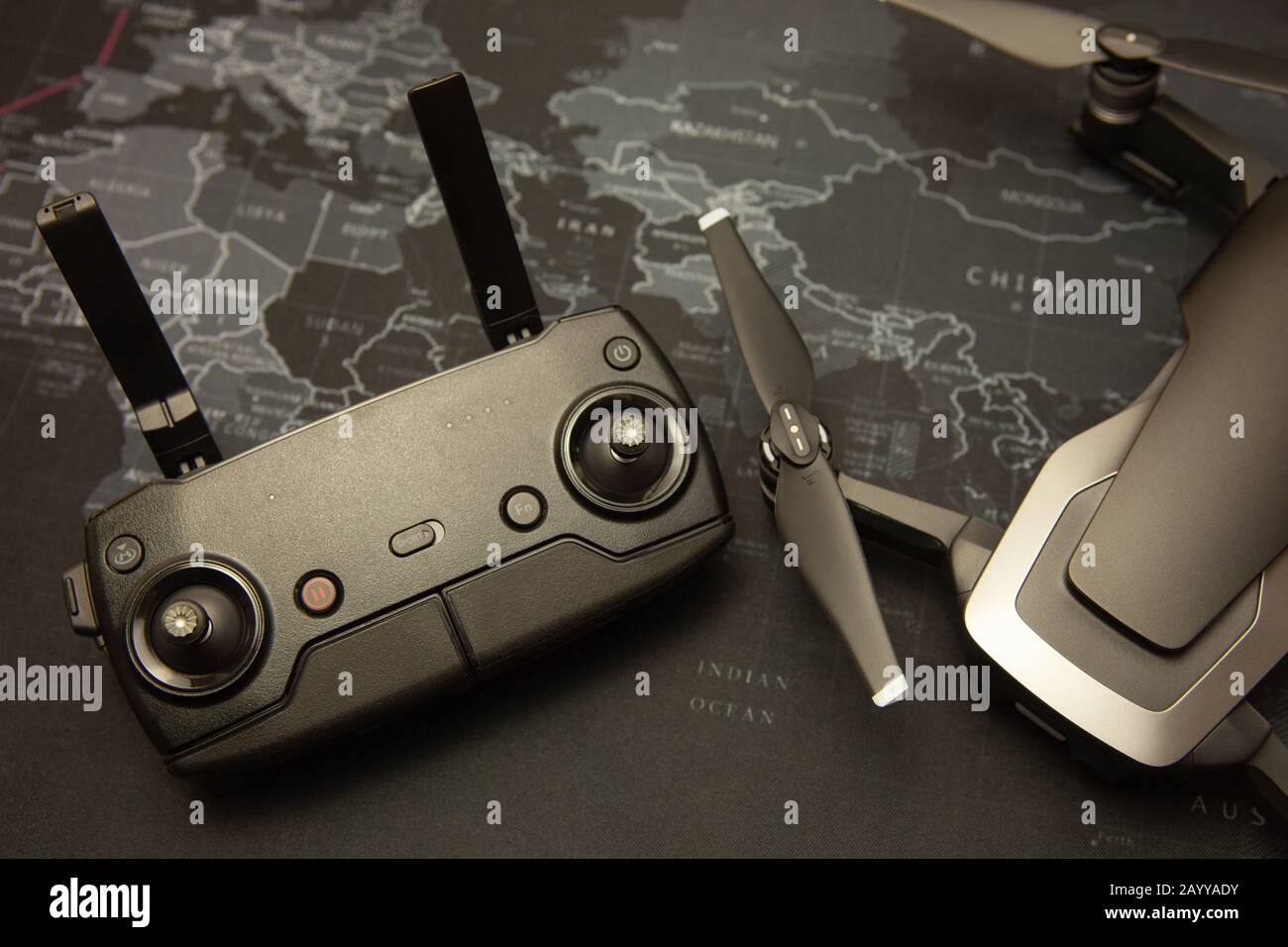 Drone copter with remote controller on world map background Stock Photo ...