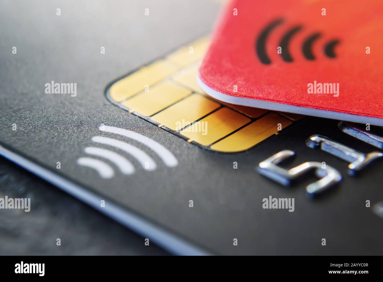Close-up of black and red plastic credit cards with chip and ...