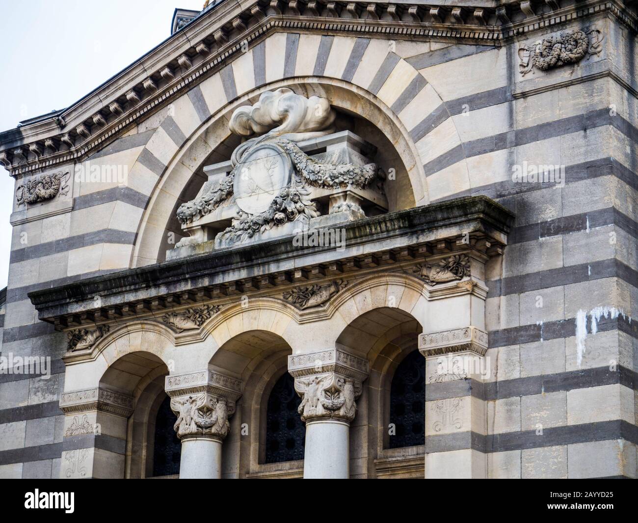 Facade of a crematorium made of black and white stripes of stone ...