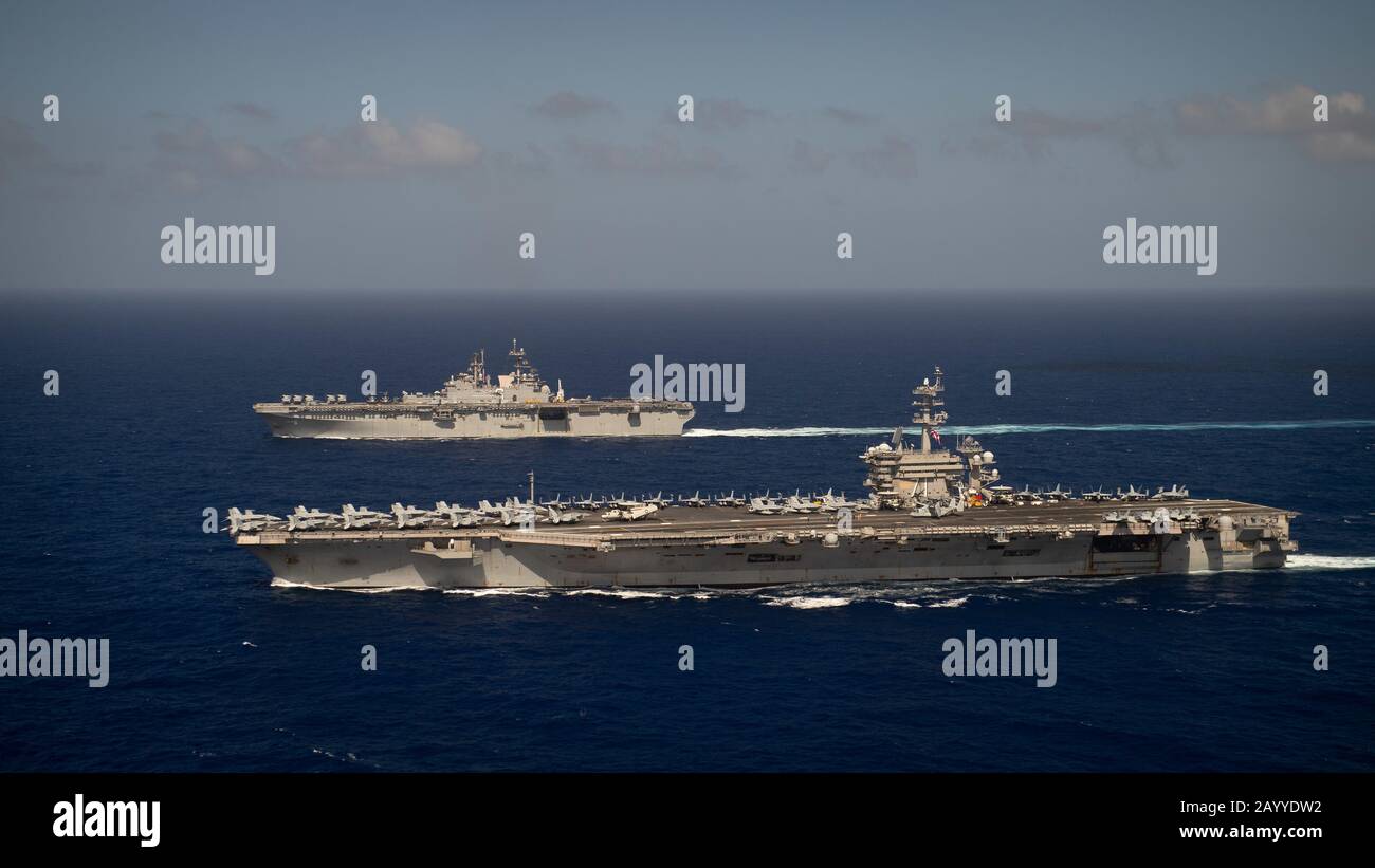 The U.S. Navy Nimitz-class nuclear powered aircraft carrier USS Theodore Roosevelt and the ...