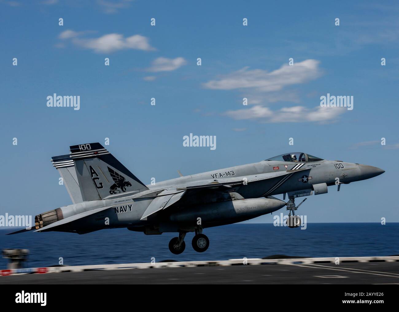 A U.S. Navy F/A-18E Super Hornet fighter aircraft attached to the Pukin ...