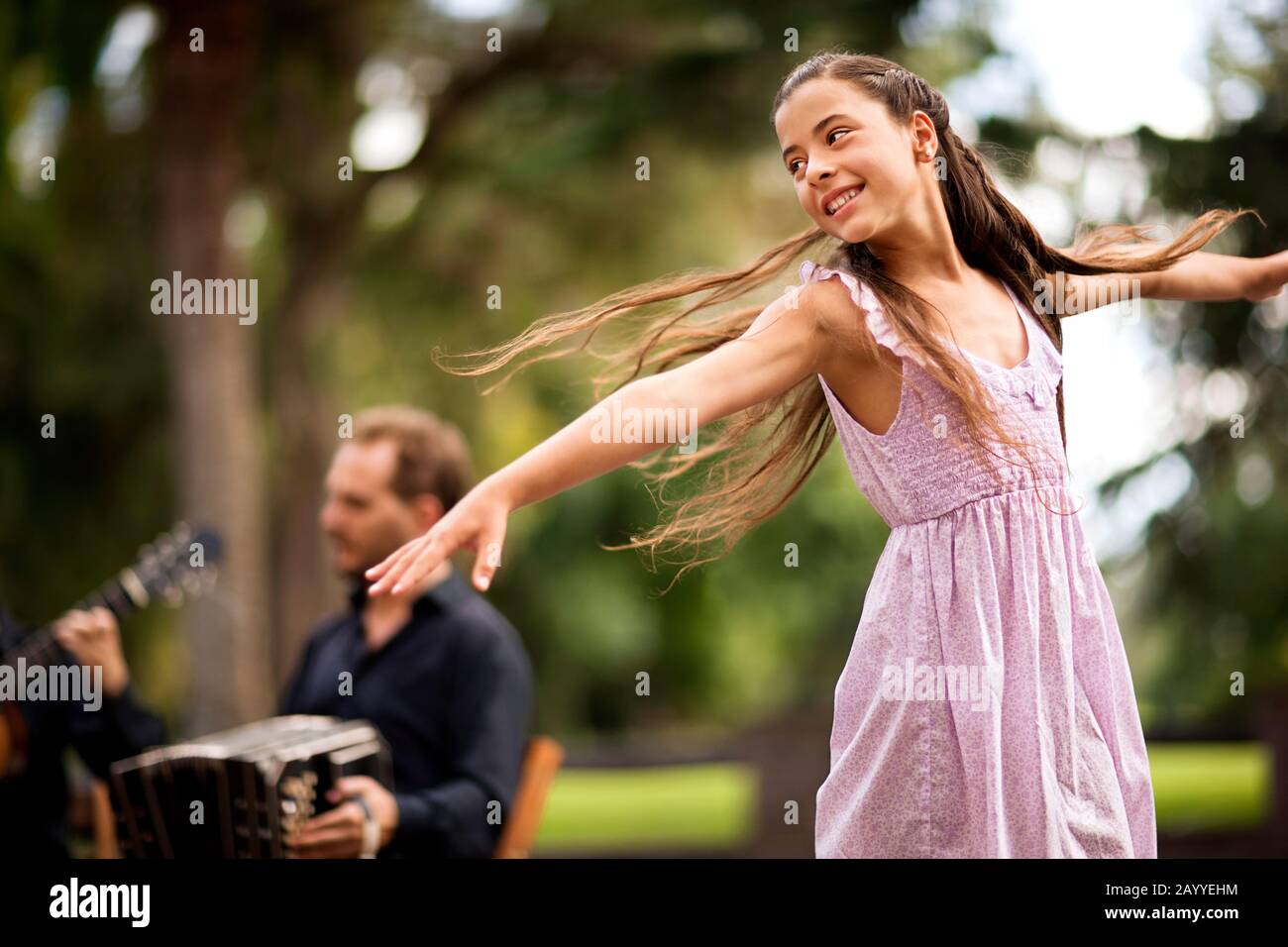 Young girl dancing to a live band Stock Photo - Alamy