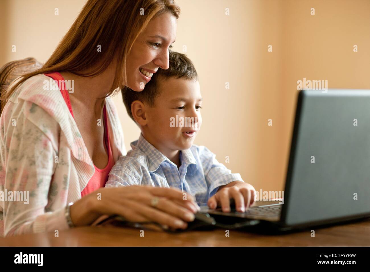 Mom communicates with two children hi-res stock photography and images ...