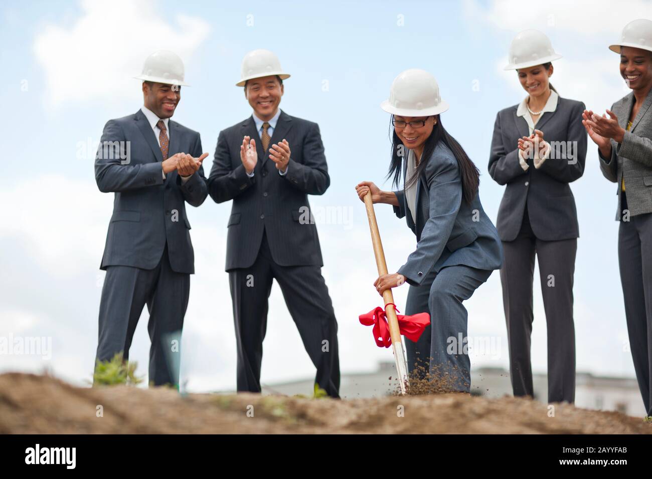 Group of business colleagues breaking ground on a project Stock Photo ...