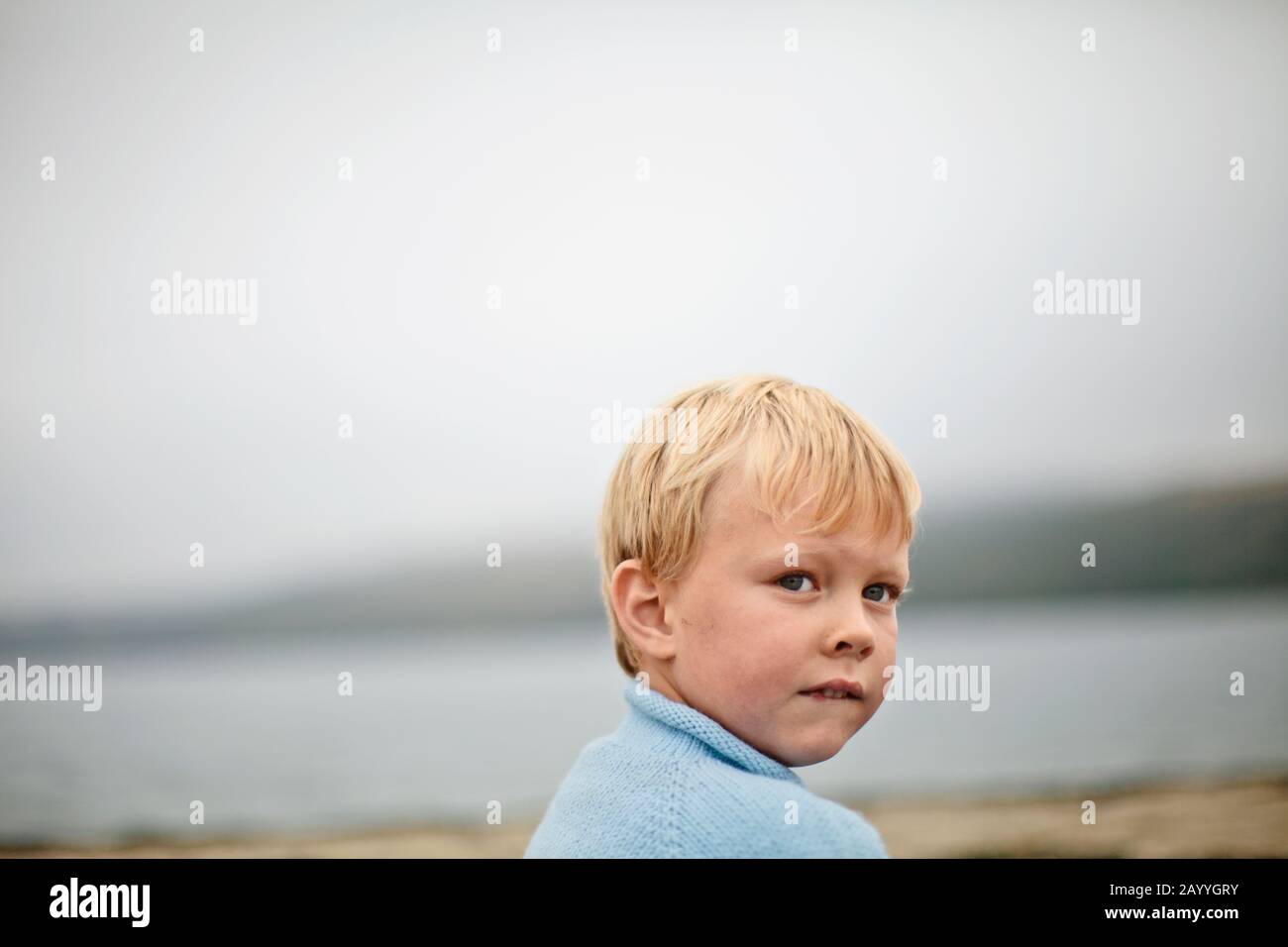 Boy biting lip hi-res stock photography and images - Alamy