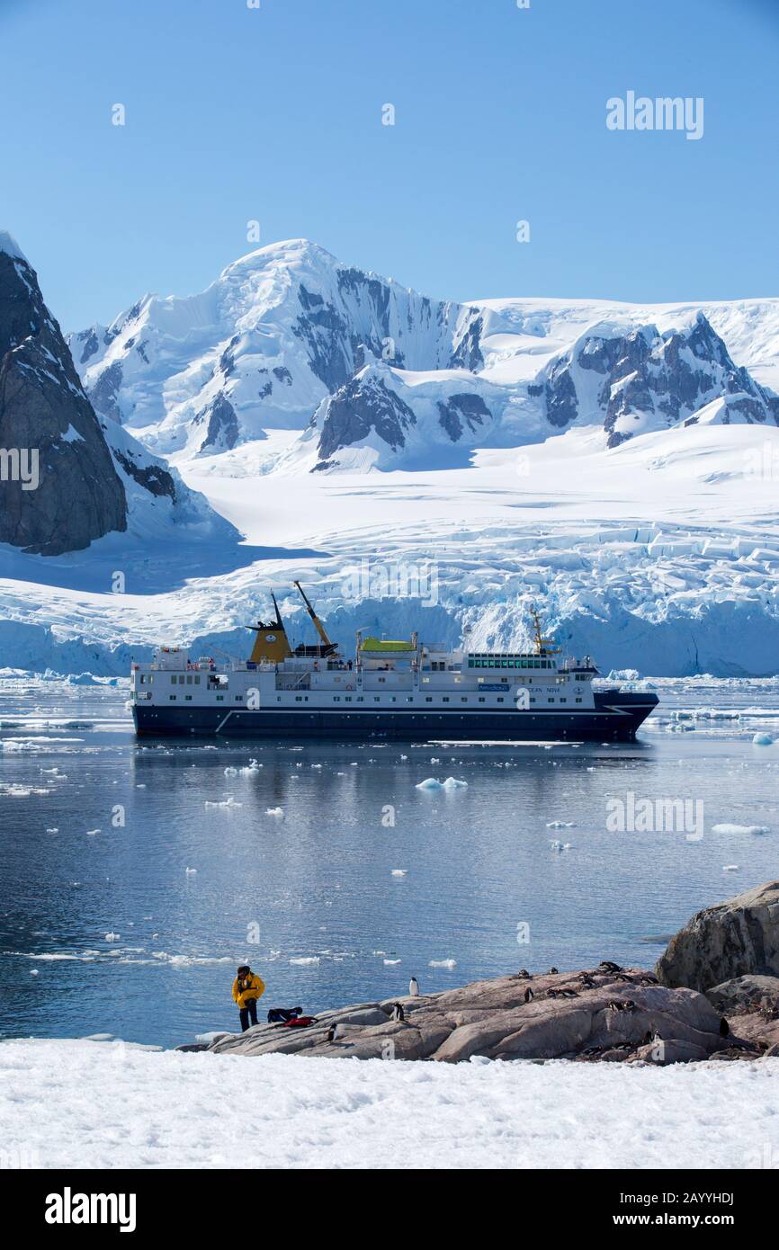 The Ocean Nova, an expedition cruise ship moored off Peterman Island ...