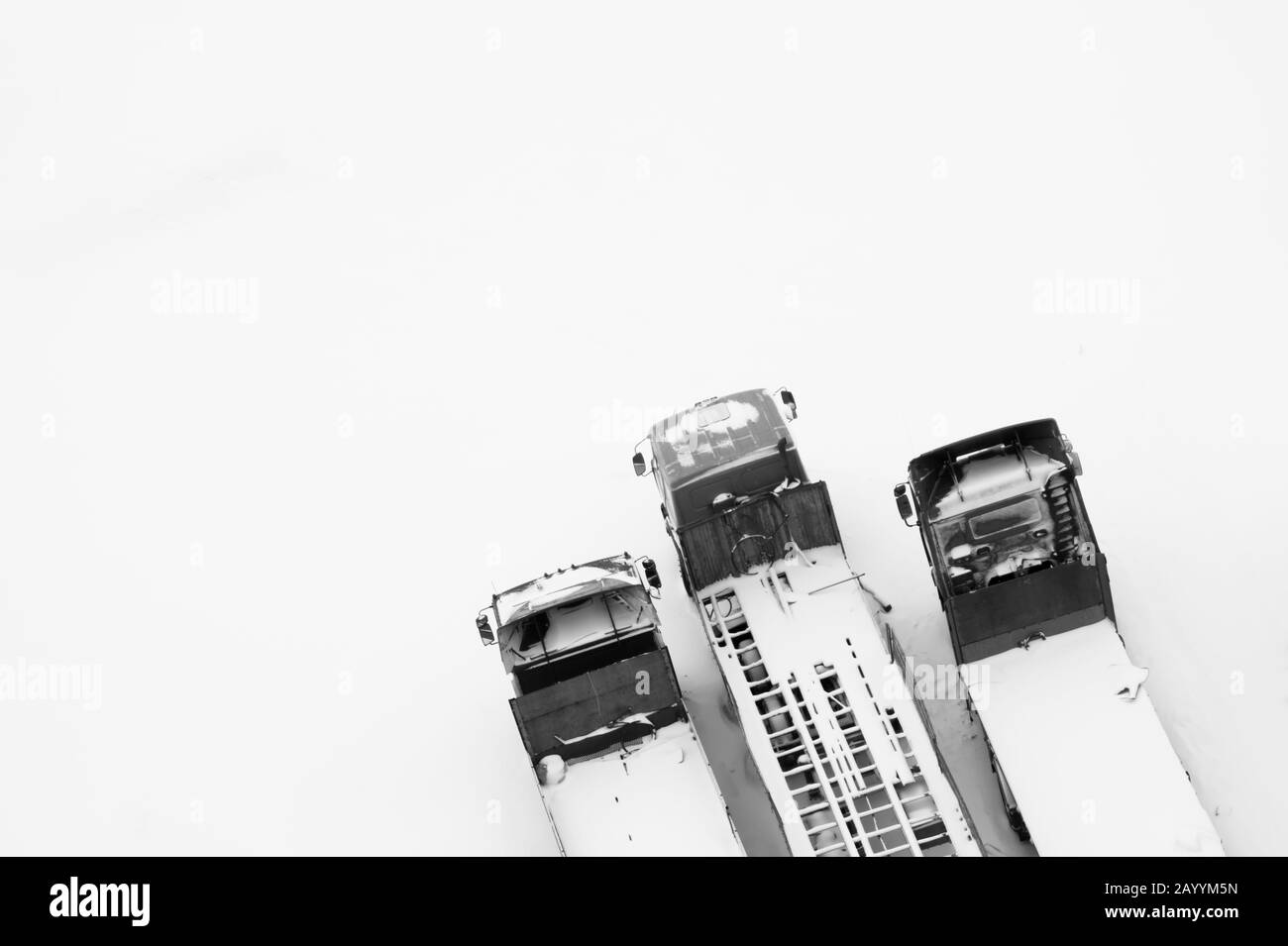 Truck under the snow. lorry covered with snow after snowfall. long ...