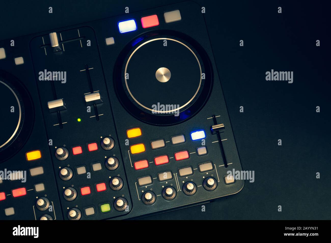 Dj sound mixer controller with knobs and sliders close up. audio mixing ...