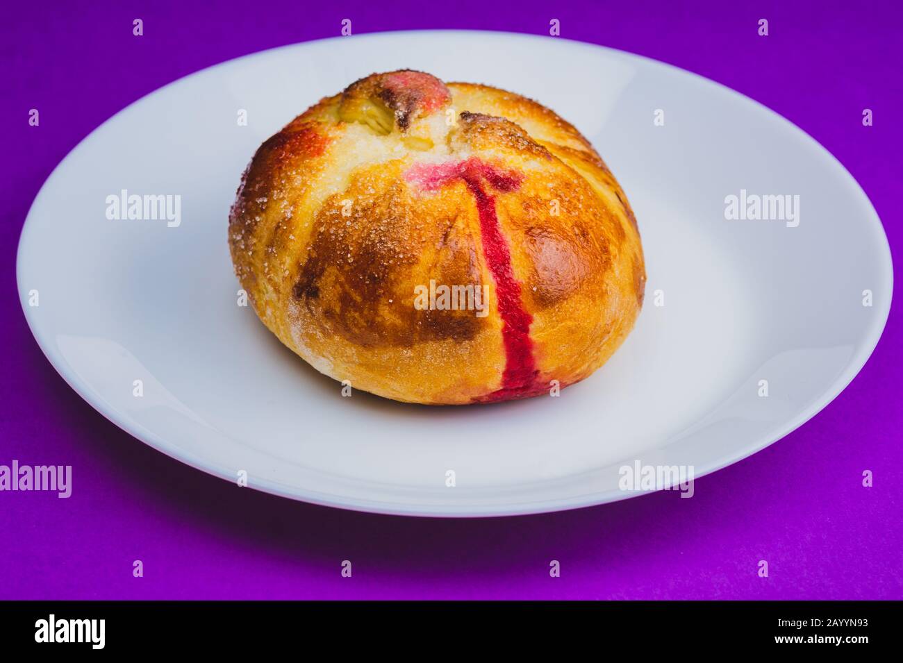 Bun with red sweet jam inside. sweet baking close up Stock Photo - Alamy