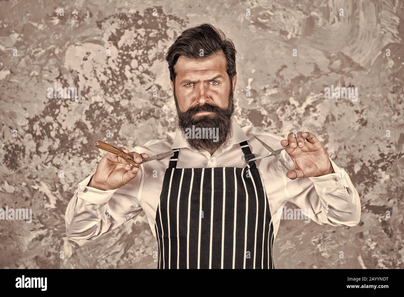 Facial hair. Bearded barber shaving. Barber tools. Barber in apron ...