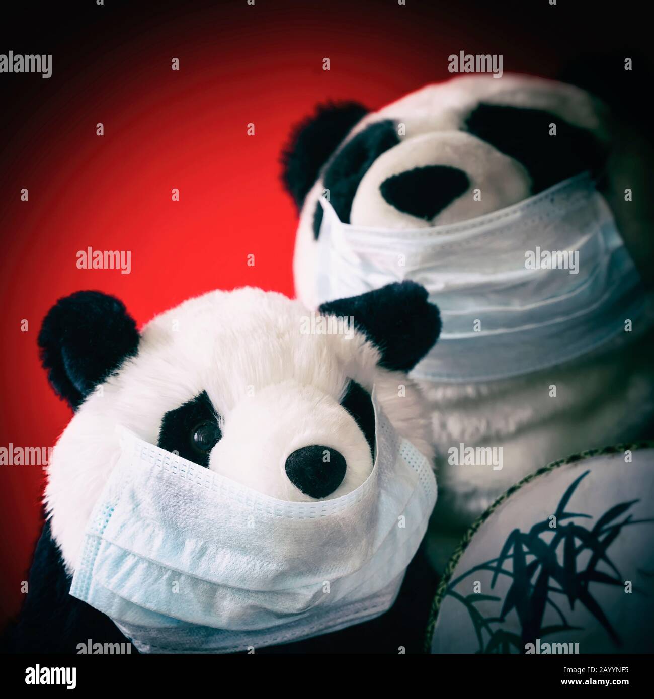 Abstract background with toy pandas in disposable protective sterile ...