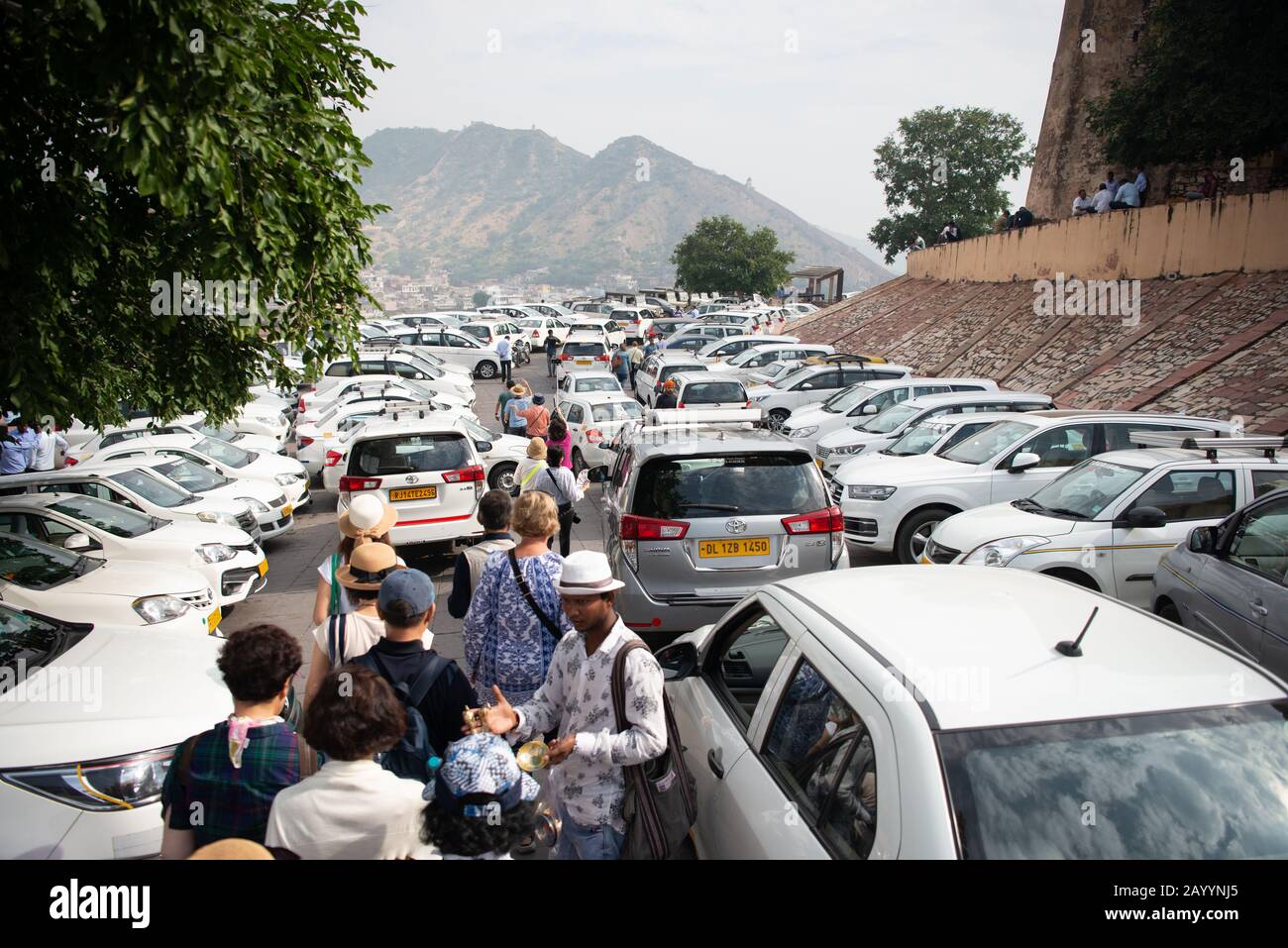 Tourist cars crowd into the parking lot of the Amber Fort in Amer ...