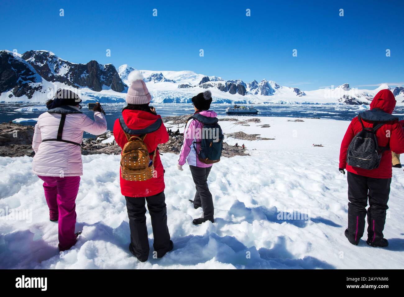 Tourists from an expedition cruise ship on Peterman Island near the ...