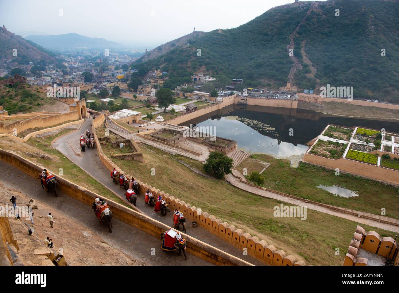 Elephants lug tourists uphill to the top of the Amber Fort in Amer ...
