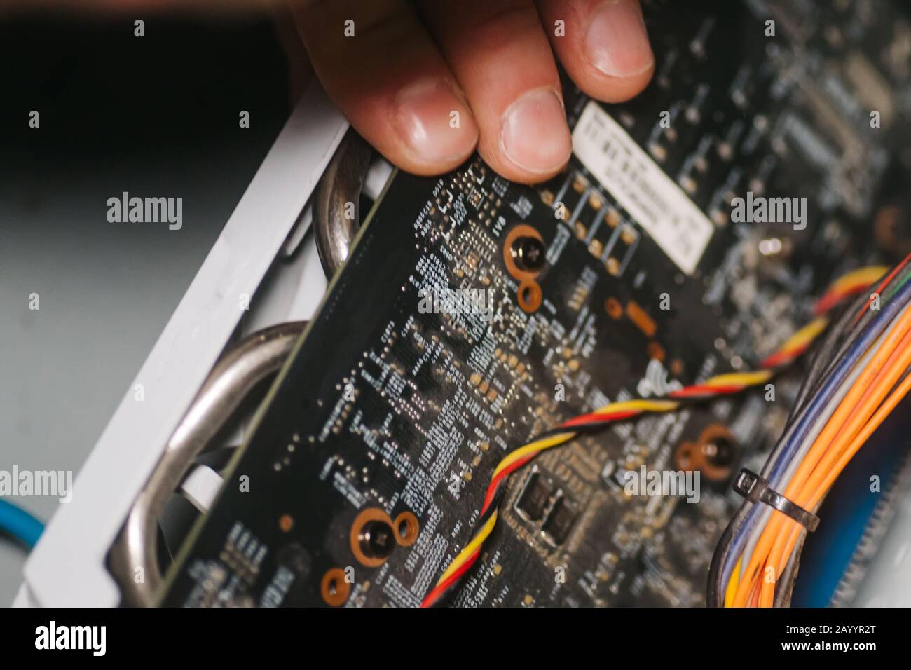 Professional man repairing and assembling computer inside. Male hand ...