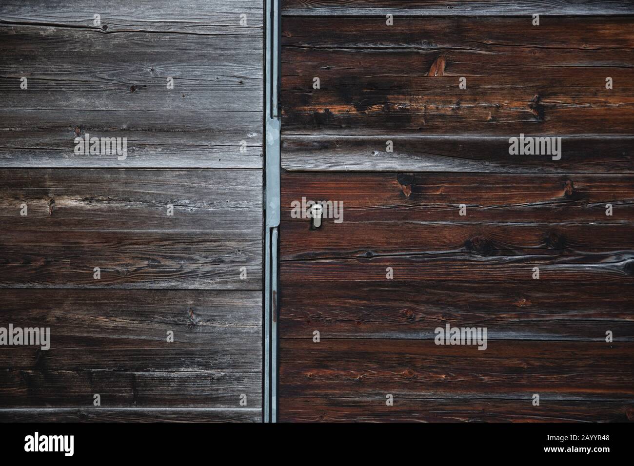In front of a wooden door with a lock Stock Photo - Alamy