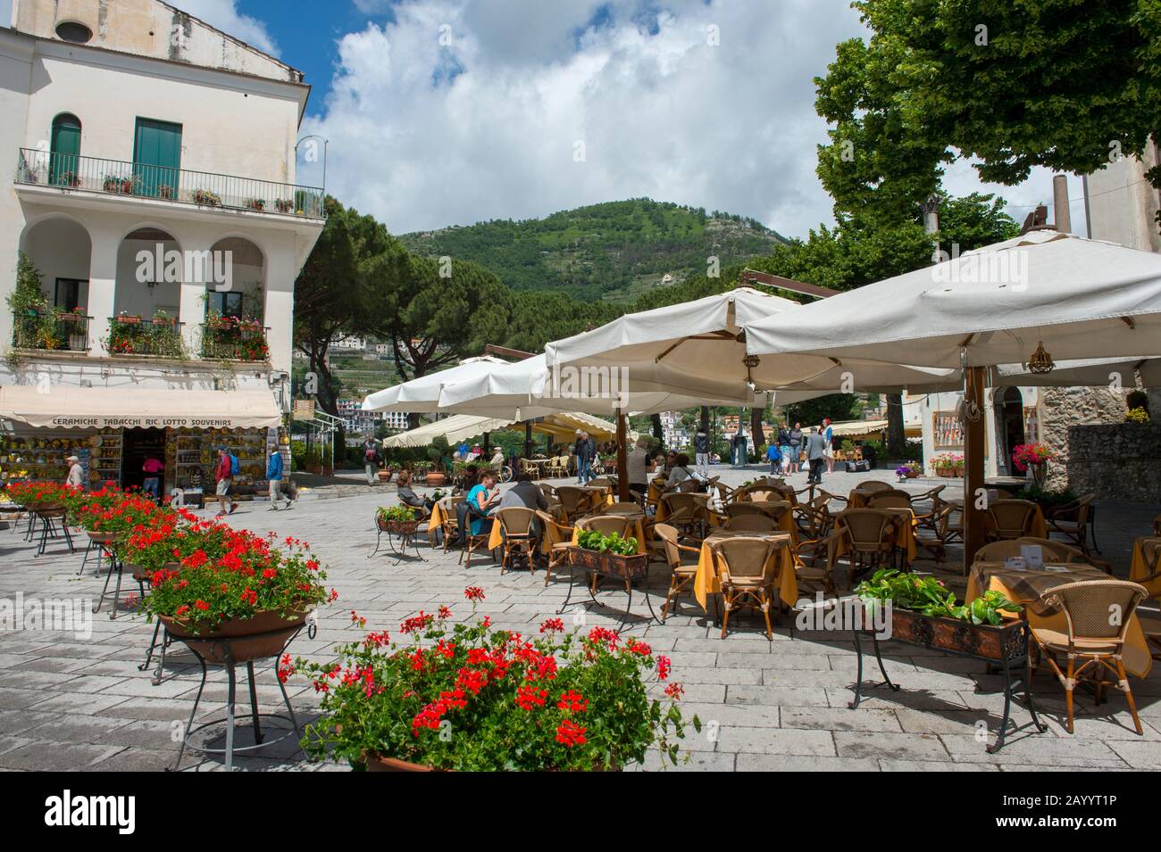 The main square with sidewalk restaurants in the center of Ravello, a ...