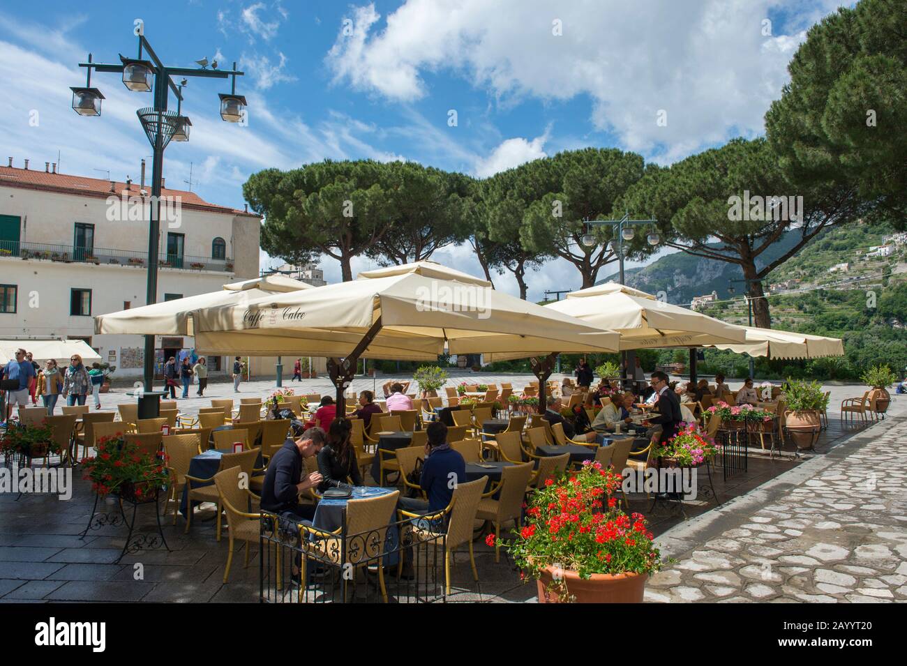 The main square with sidewalk restaurants in the center of Ravello, a ...