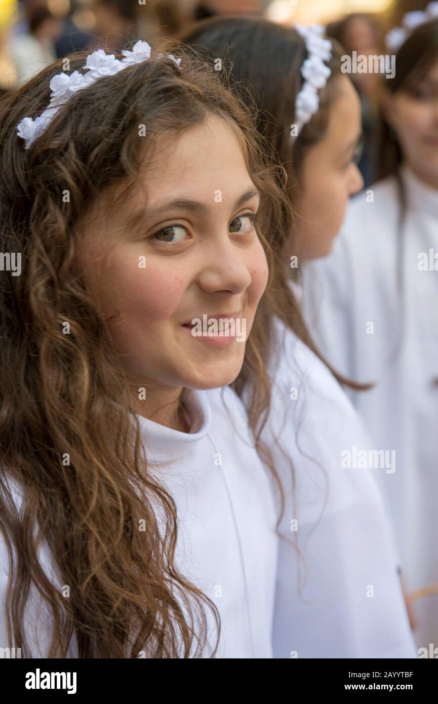 Portrait of local girl in procession for the Corpus Christi holiday, a ...