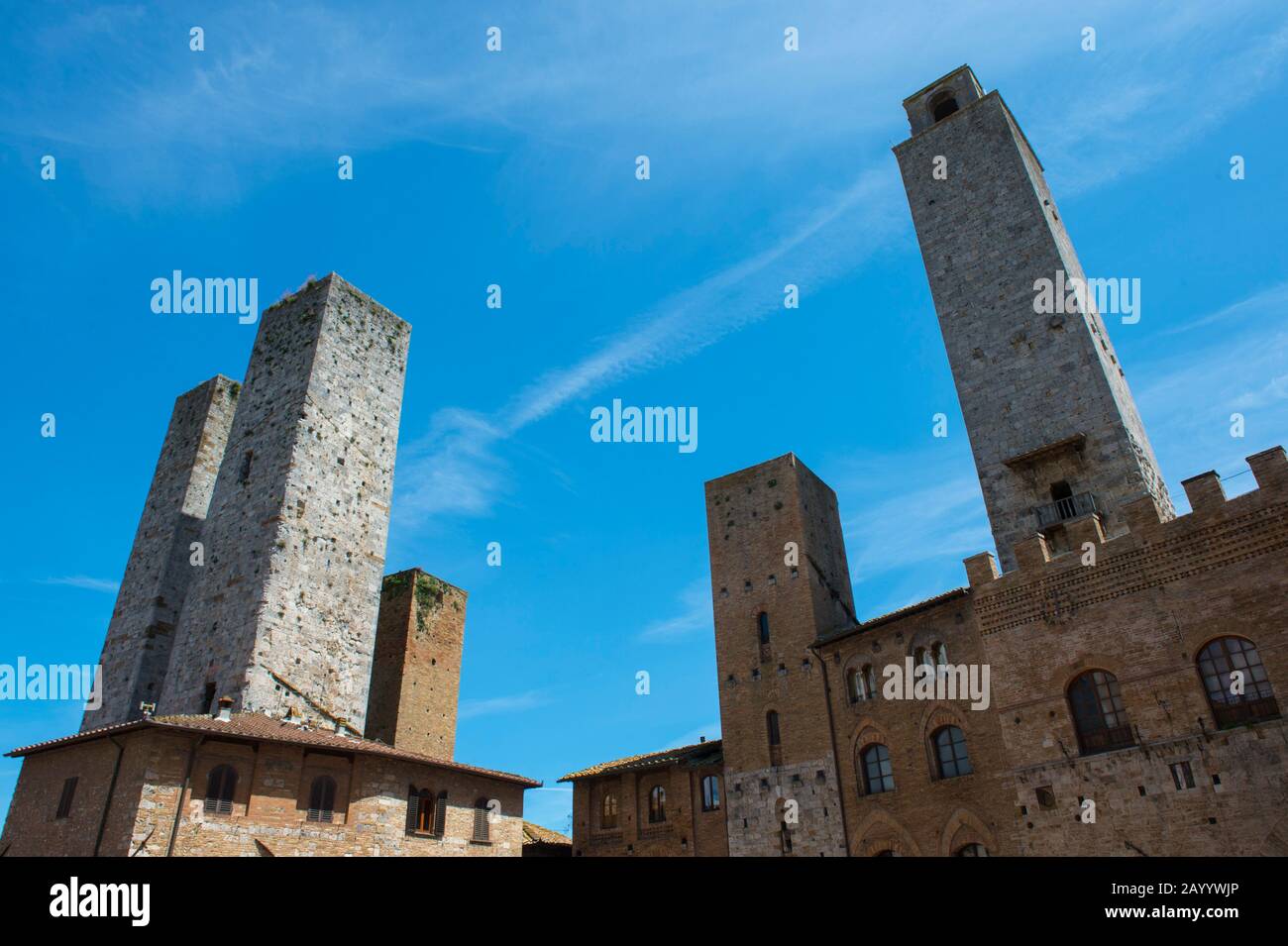 Street scene with towers in the medieval walled hill town of San ...