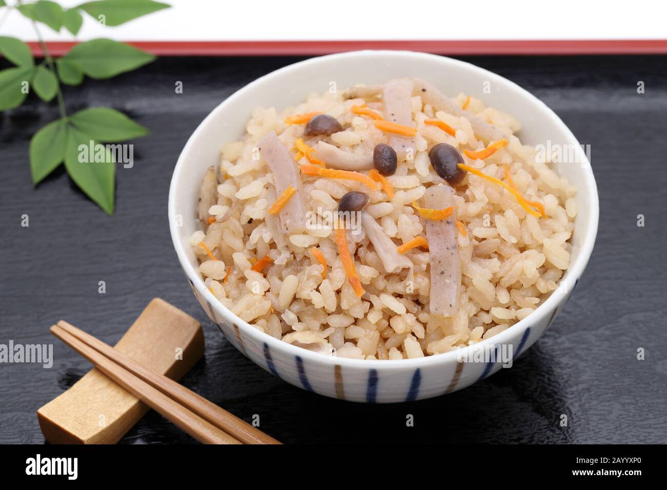 Japanese food, Takikomi gohan boiled rice on black tray Stock Photo - Alamy