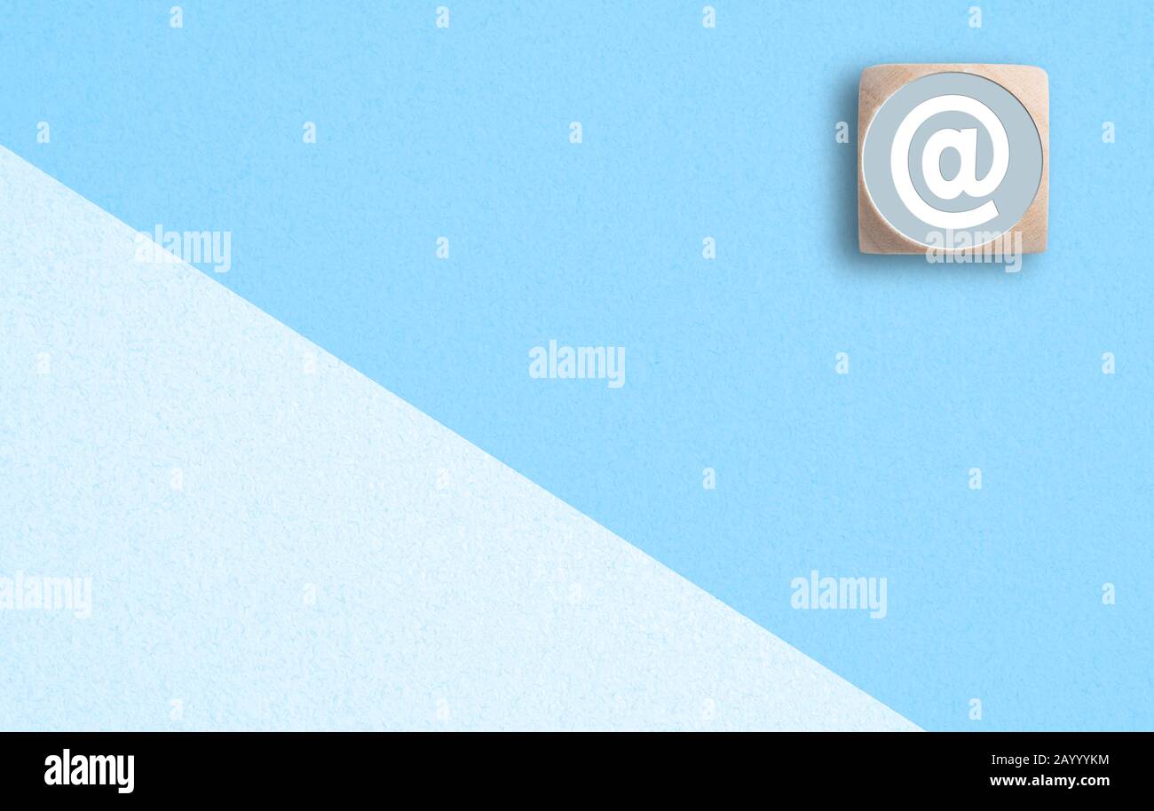 single cube with a contact option on top on blue paper background Stock ...