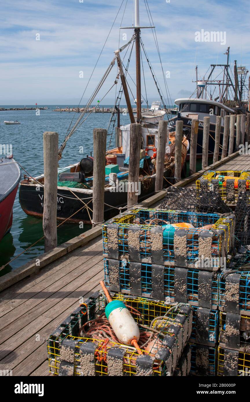 Fishing boats and lobster traps in the small fishing port of Menemsha ...