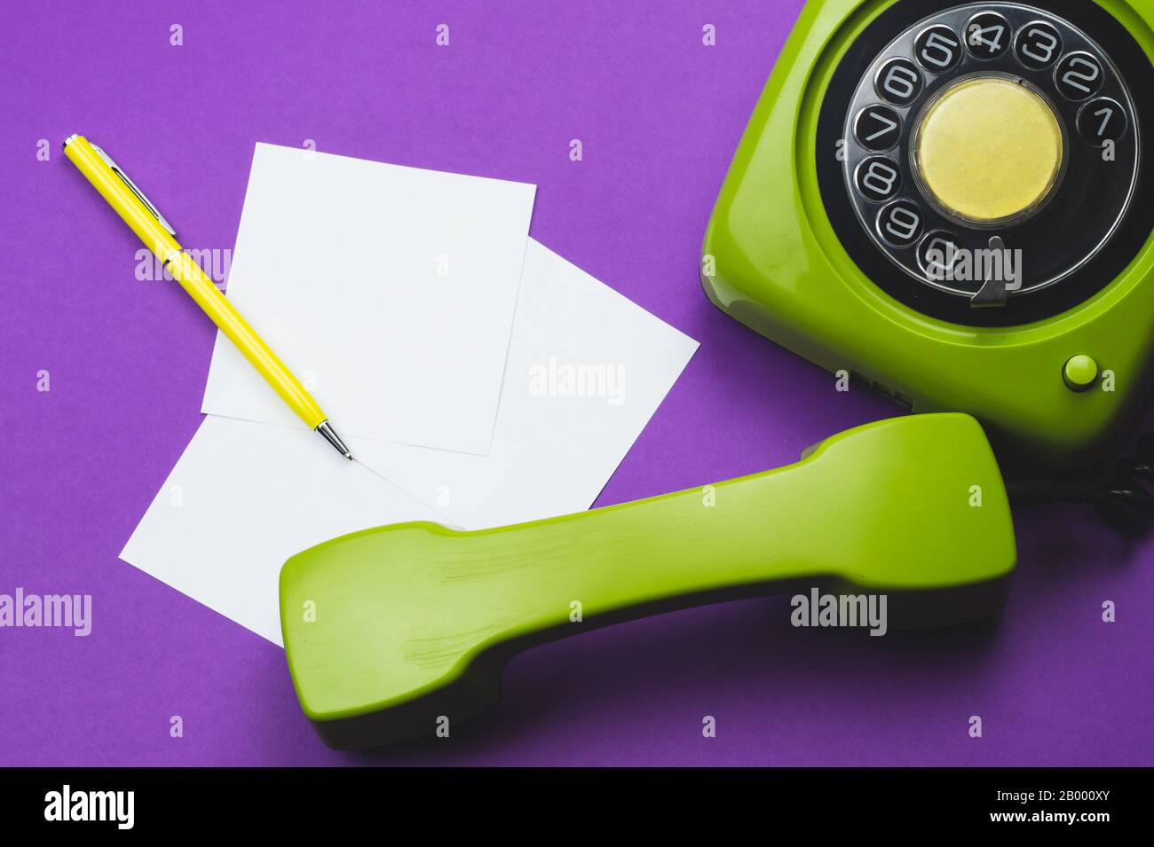Classic phone with handset. pen with a note. office background. vintage ...