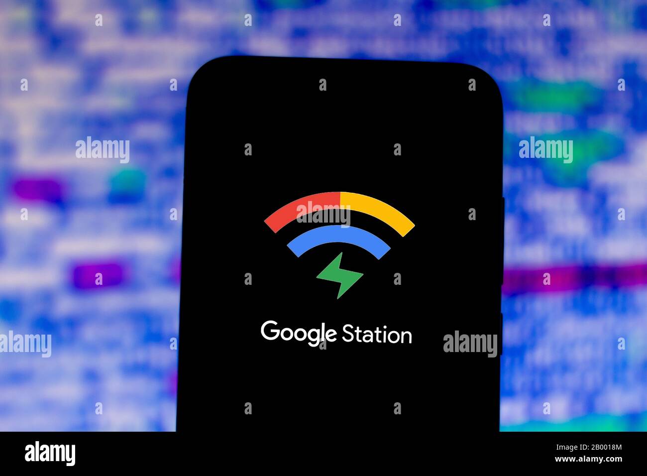 In this photo illustration the Google Station logo seen displayed on a ...