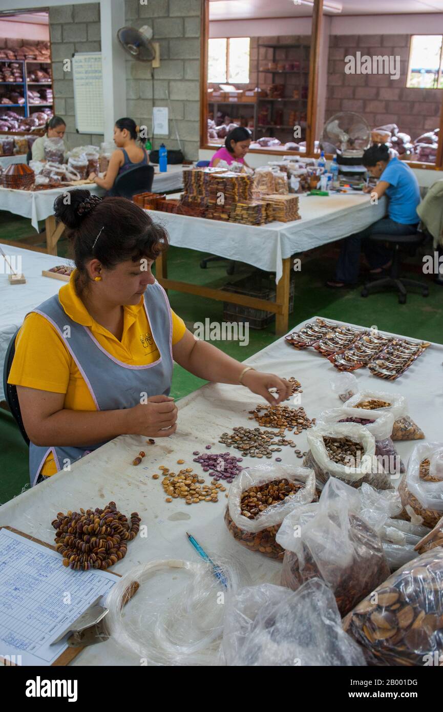 Workers producing wooden souvenirs at the Sr y Sra Ese Wooden Souvenir ...