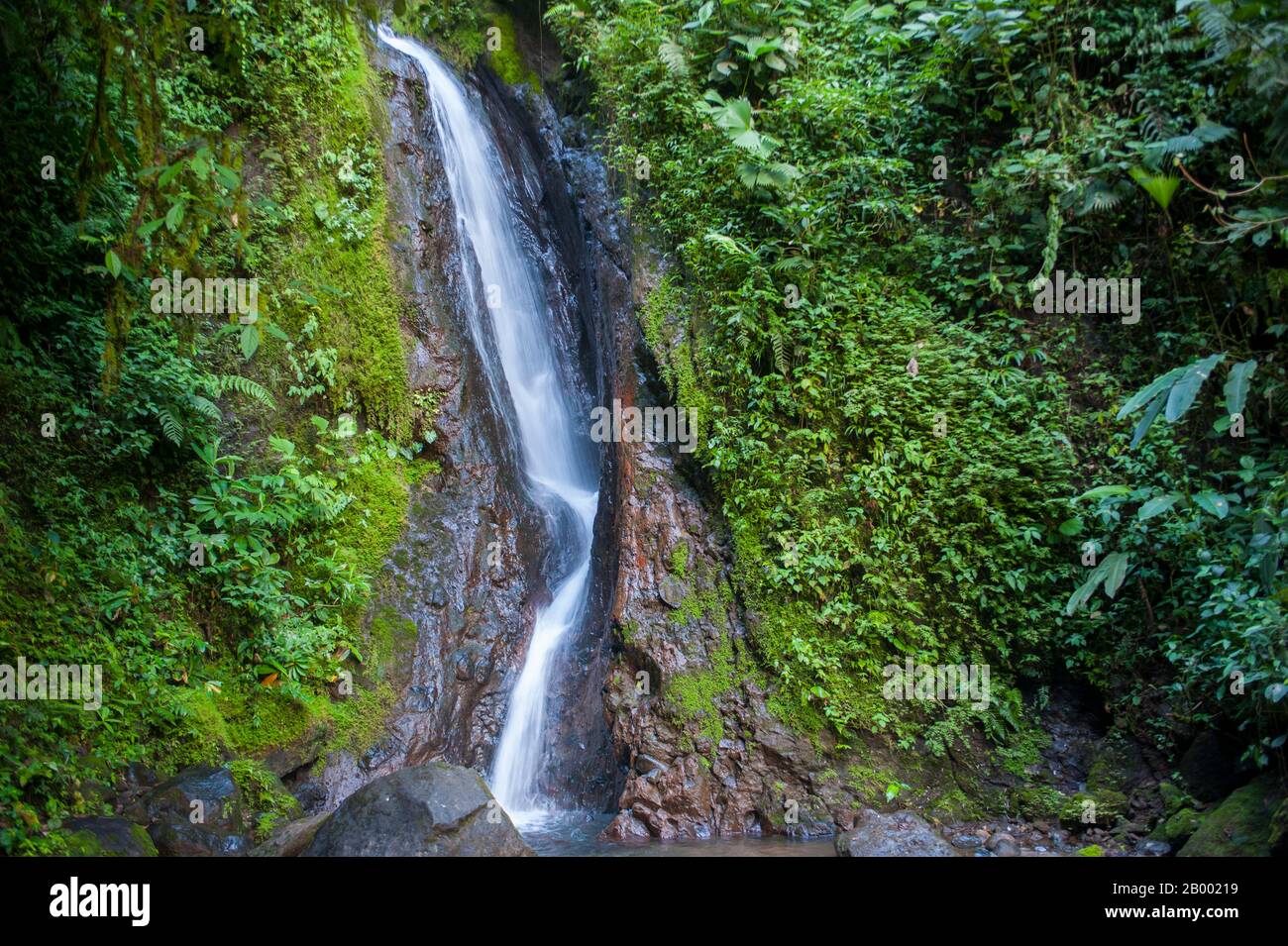 A waterfall in the rainforest near the Arenal Volcano in Costa Rica ...