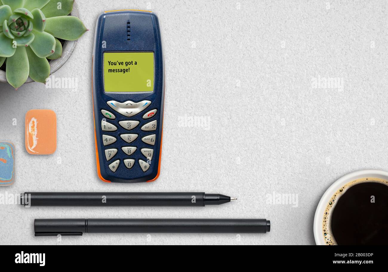 feature phone on grey paper background Stock Photo - Alamy