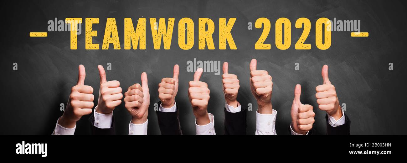 many thumbs up to "TEAMWORK 2020" written on a blackboard Stock Photo ...
