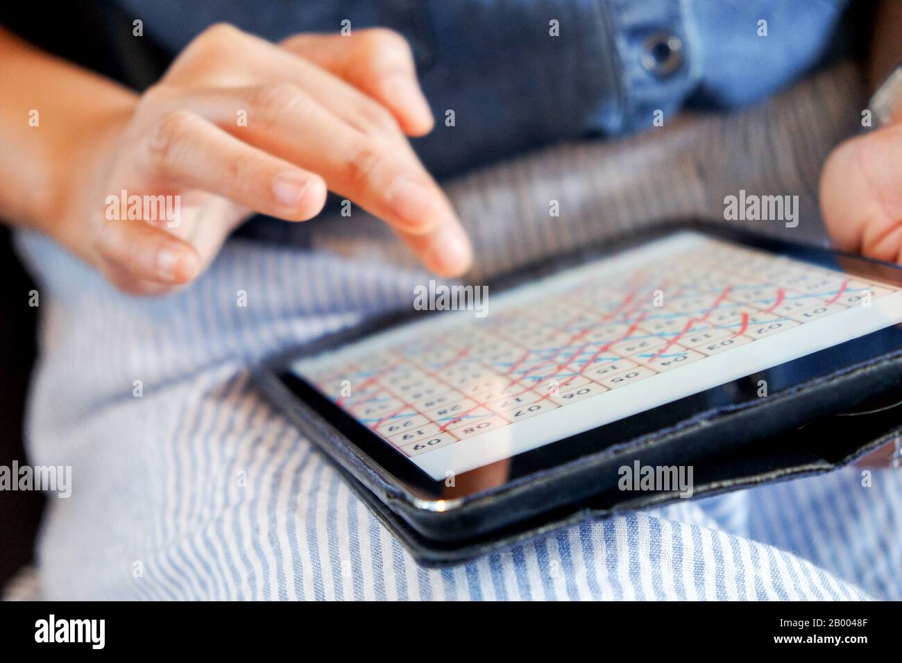 image of people using a digital tablet Stock Photo - Alamy
